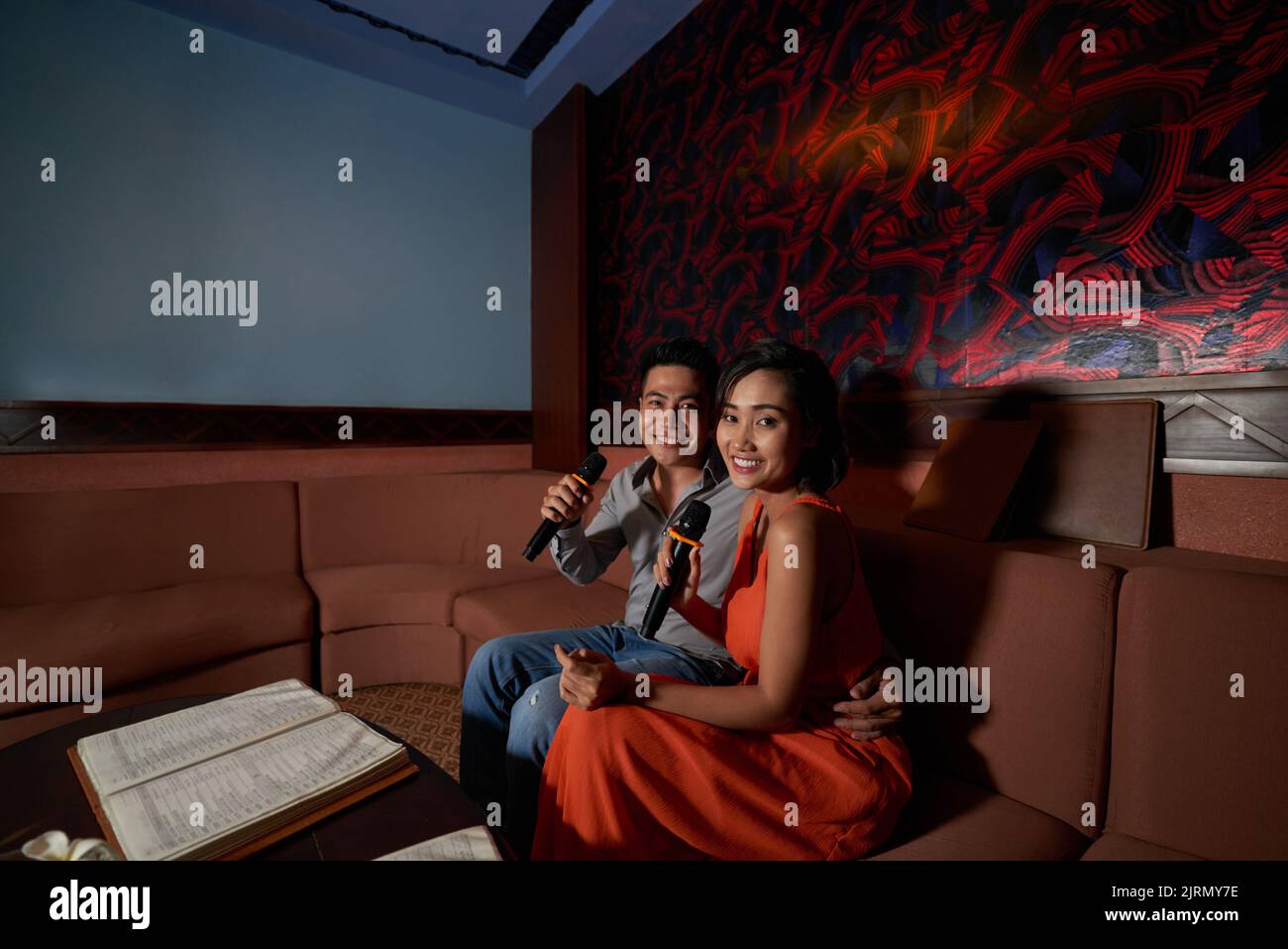 Asian man singing karaoke hi-res stock photography and images - Alamy