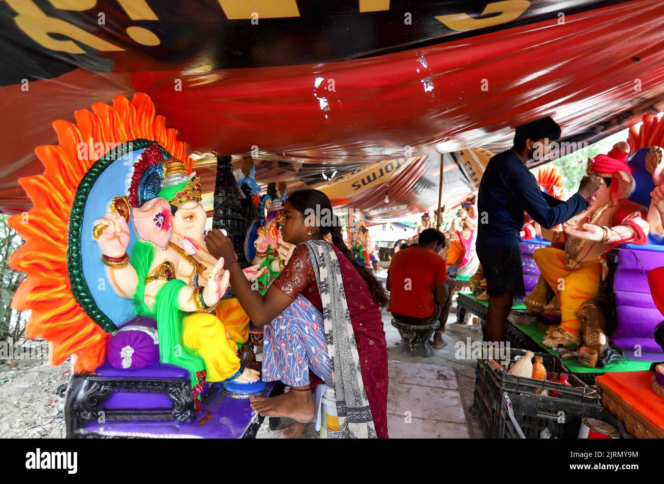 Artists work on idols of the elephant-headed Hindu deity Ganesha ahead ...