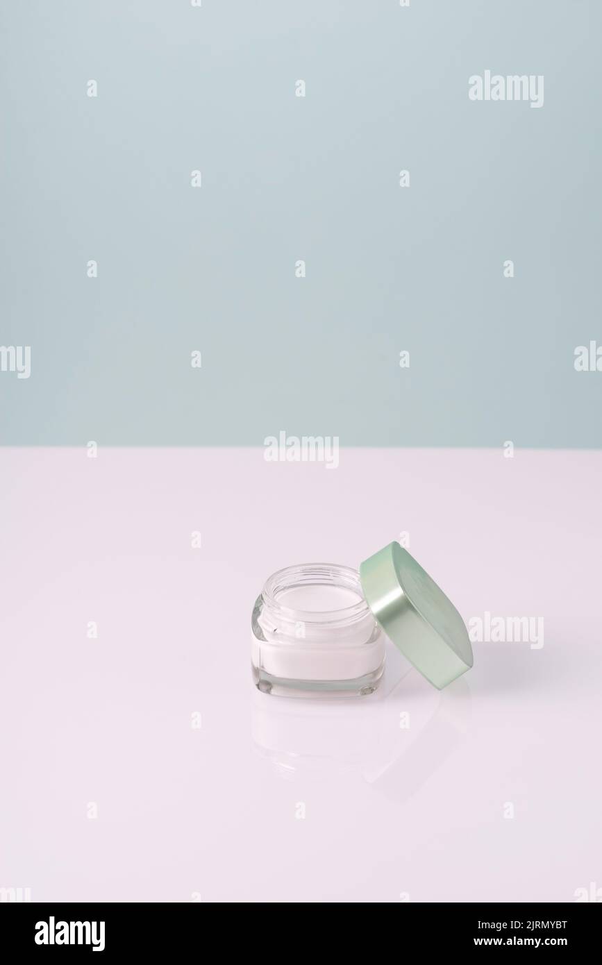 face cream in a glass container on a white-blue background Stock Photo ...