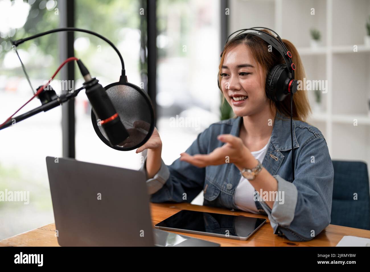 Young woman recording audio hi-res stock photography and images - Alamy