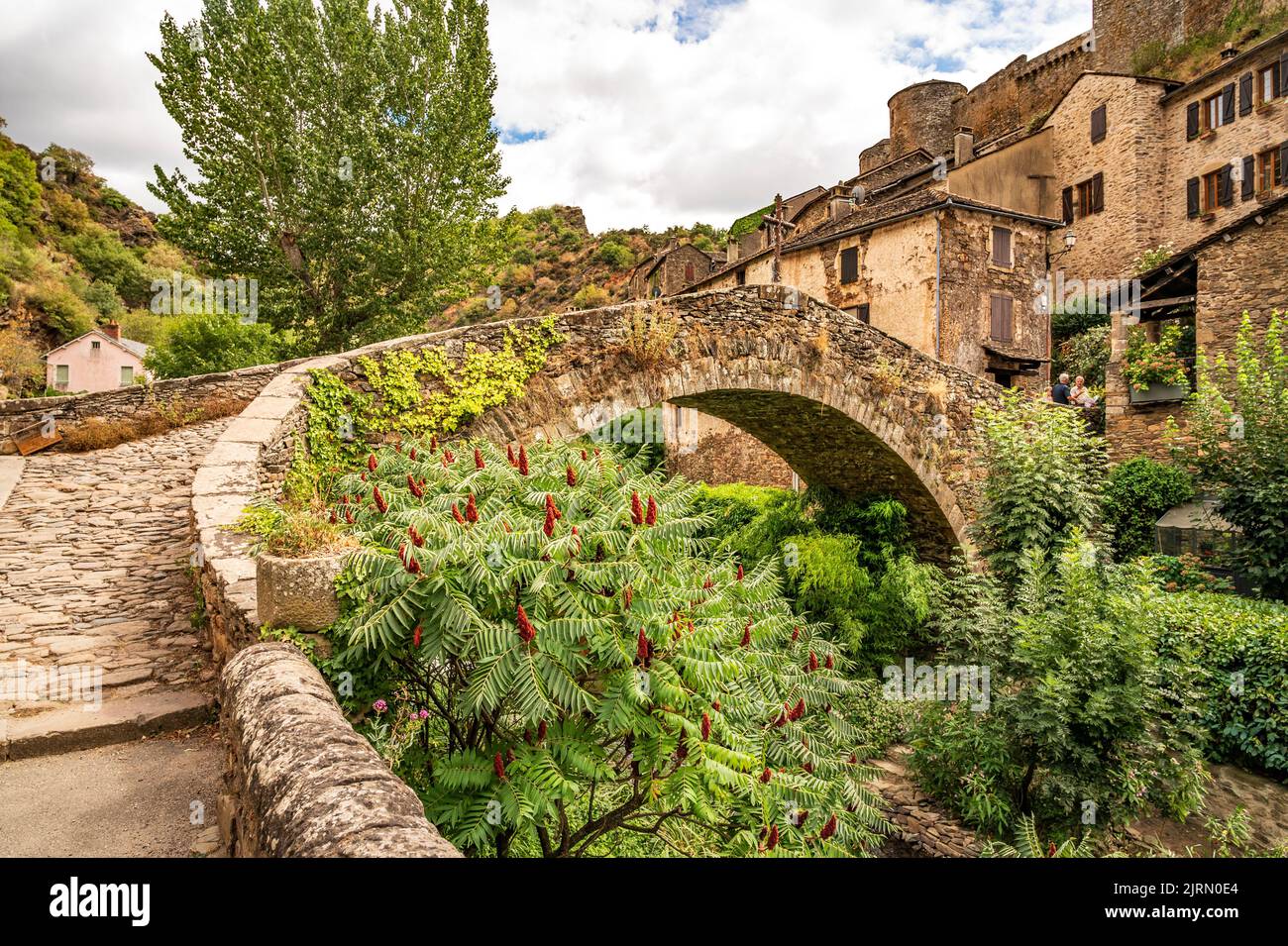 The Gothic stone bridge pont cournut of Brousse-le-Château, France ...