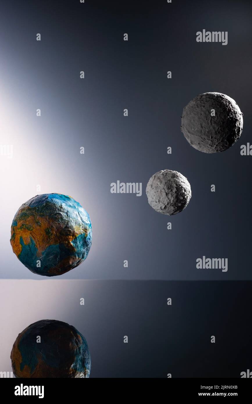surrealism planet earth over water on a gray background Stock Photo - Alamy