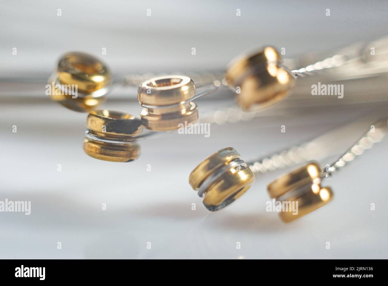 macro details of strings for electric guitar on a white background ...
