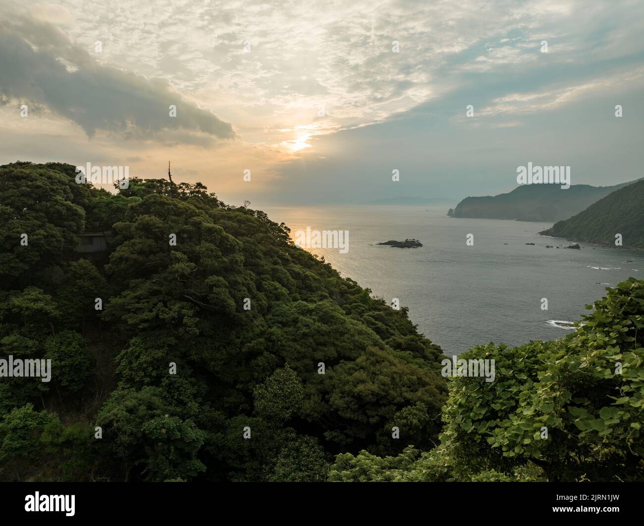Sunrise over small offshore island on rugged Sea of Japan coast Stock ...
