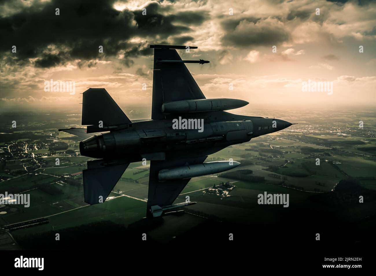 An F-16 Falcon multirole fighter aircraft maneuvering in the sky during ...