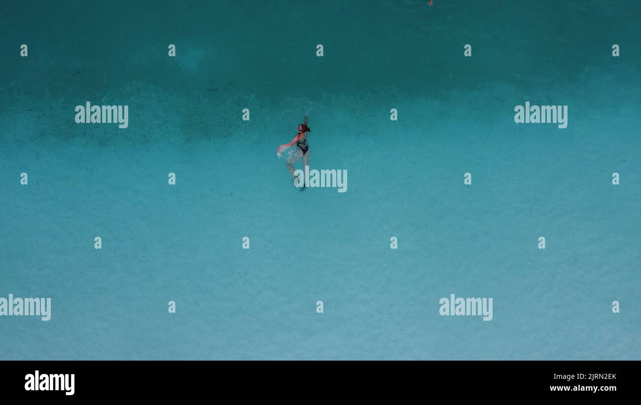 Aerial shot female swimming in hi-res stock photography and images - Alamy