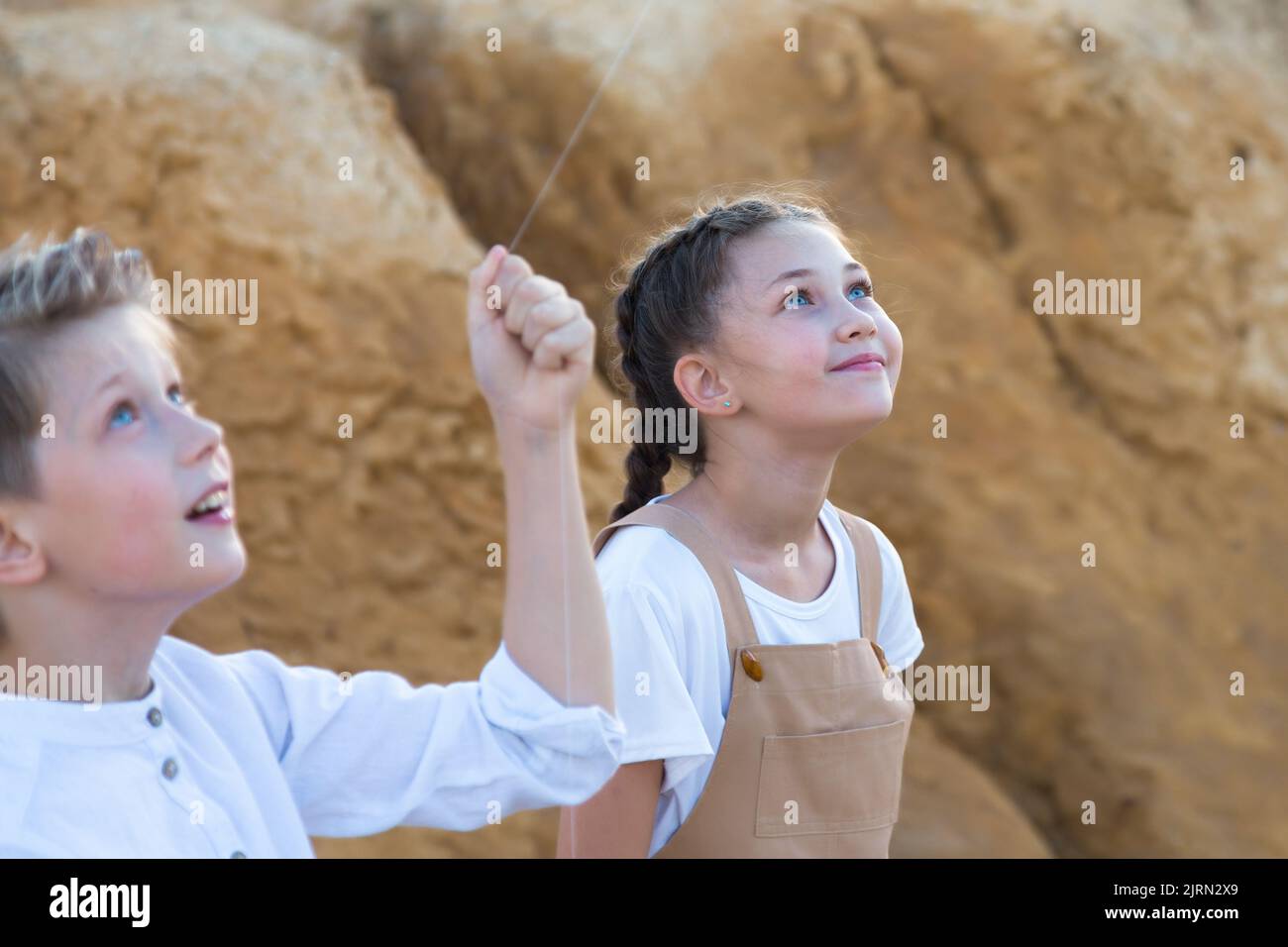 Kid fly kite up in sky hi-res stock photography and images - Alamy