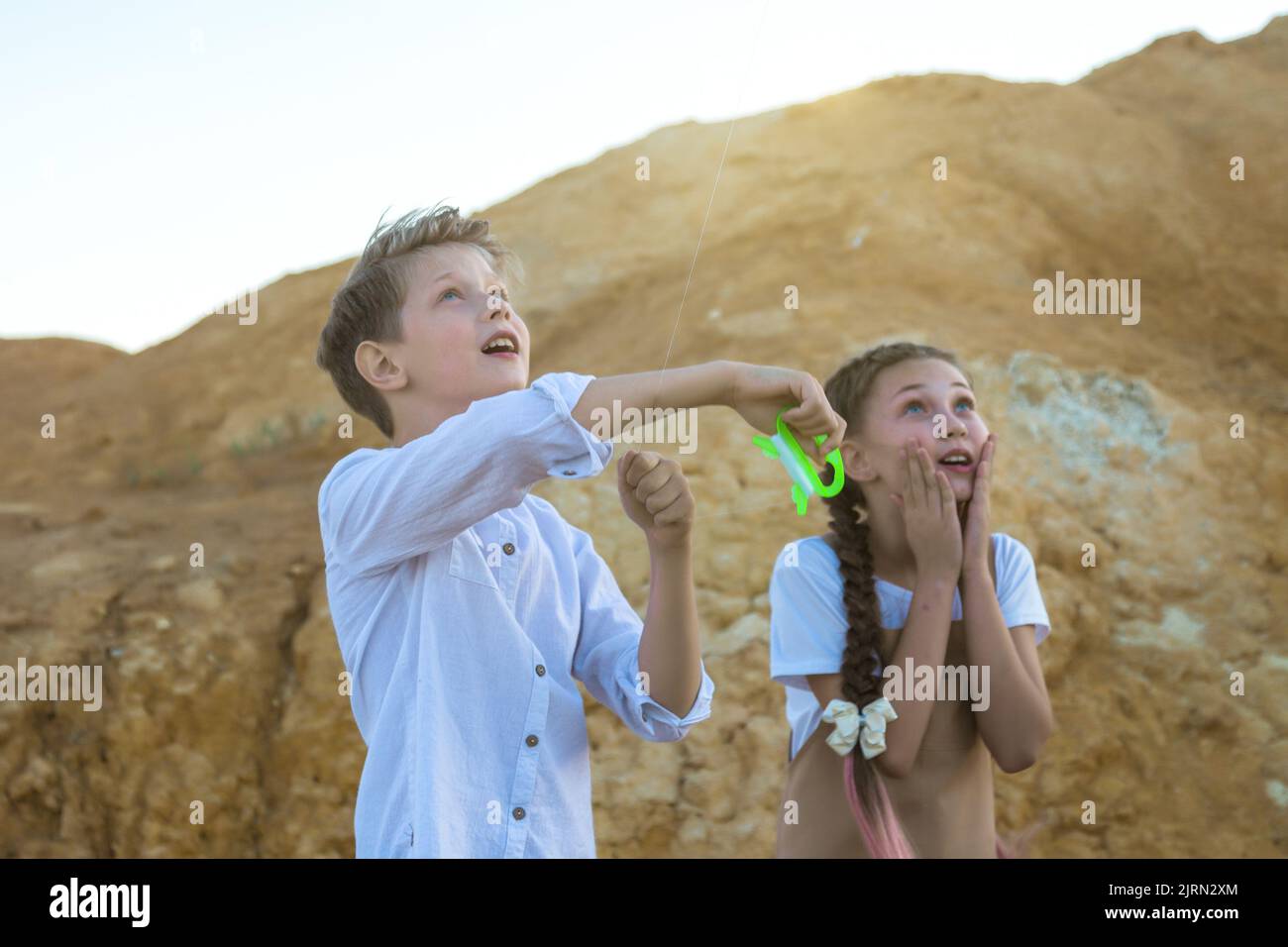 Kid fly kite up in sky hi-res stock photography and images - Alamy