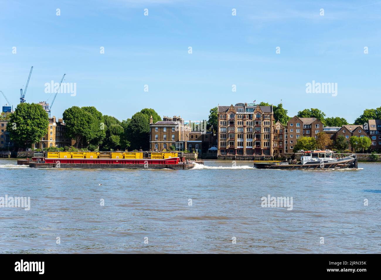 Cory Environmental tug Recovery pulling barge load on the River Thames ...