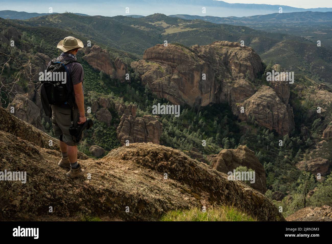 Hiker Looks Out Over The Western Side of Pinnacles From The High Peaks ...