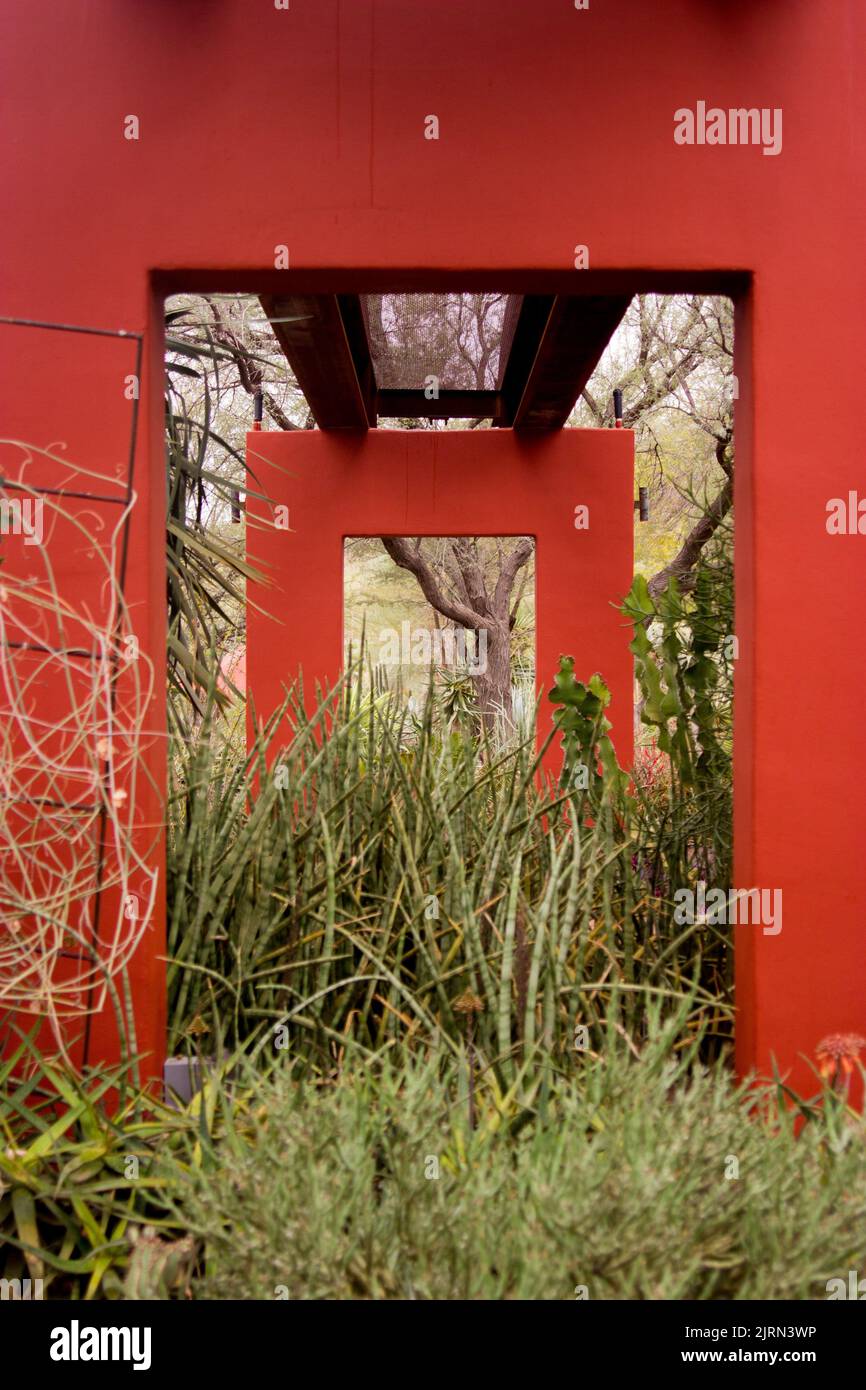 The red square arches with plants in a vertical shot Stock Photo - Alamy