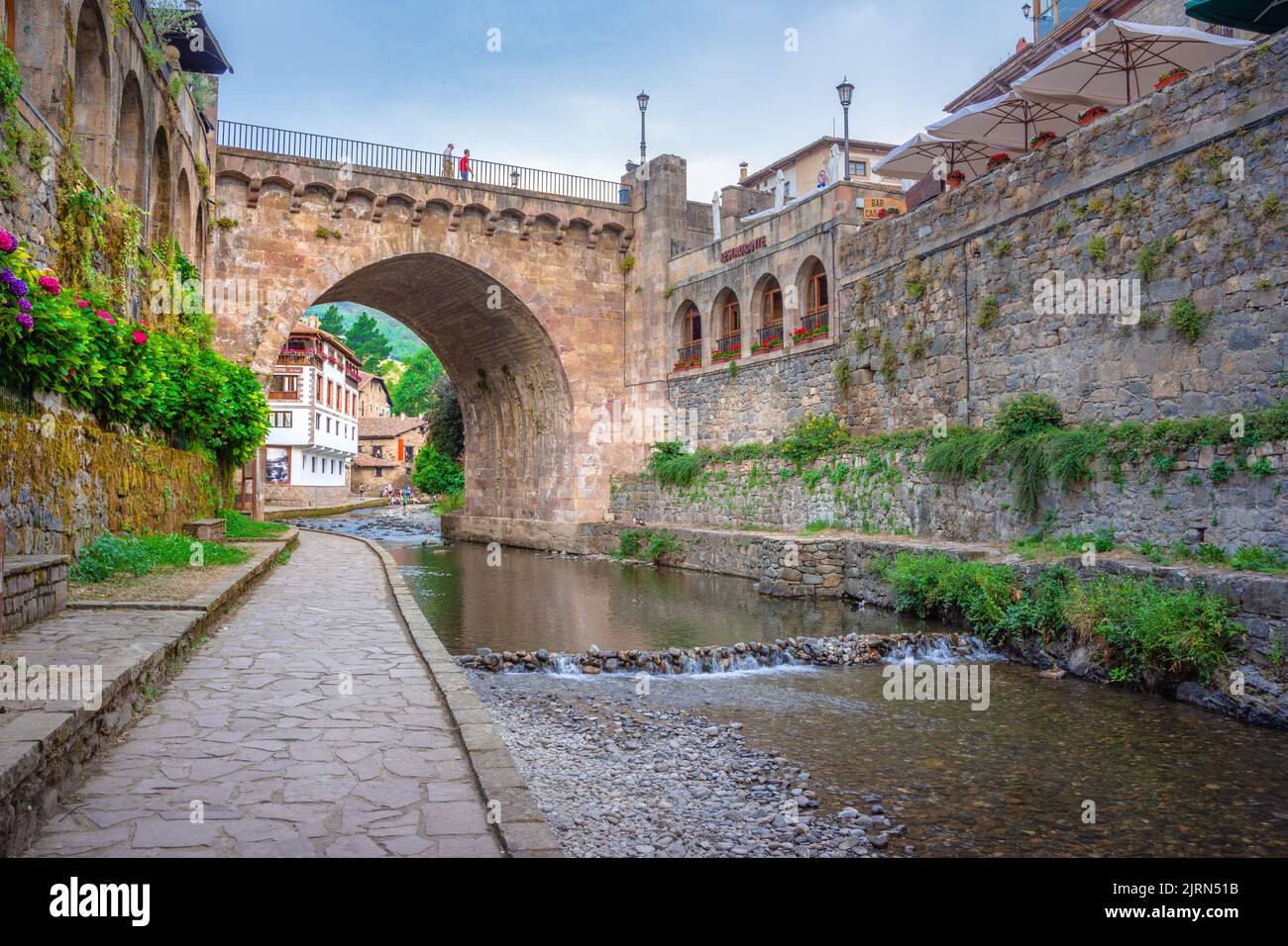 Medieval village of Potes with hanging houses and Deva river, Cantabria ...