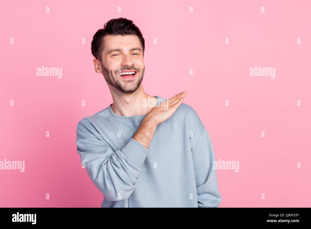 Portrait of satisfied glad person toothy smile arm touch wipe shoulder ...