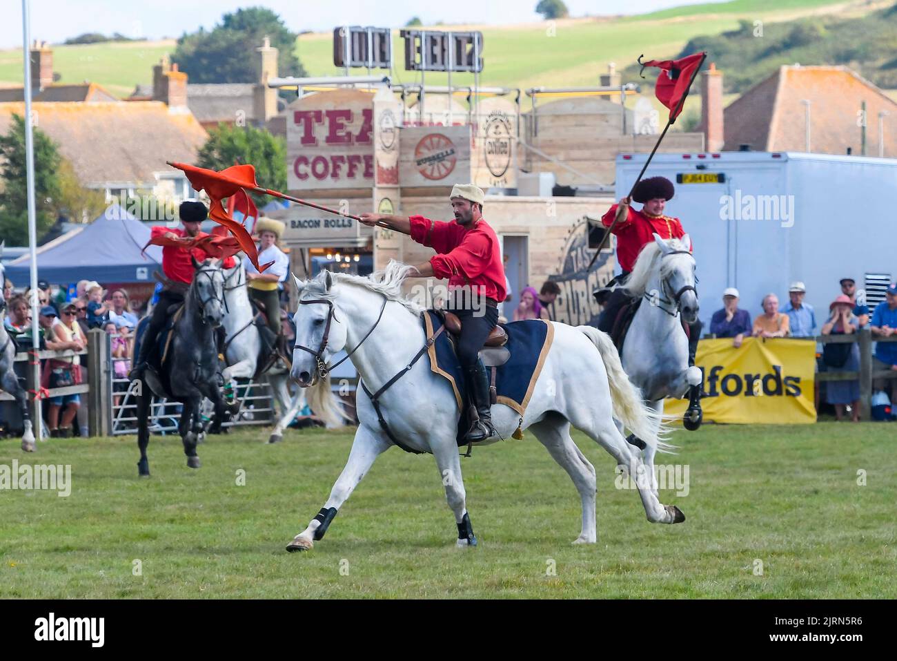 Bridport, Dorset, UK. 25th August 2022. The Devil’s Horsemen performing ...