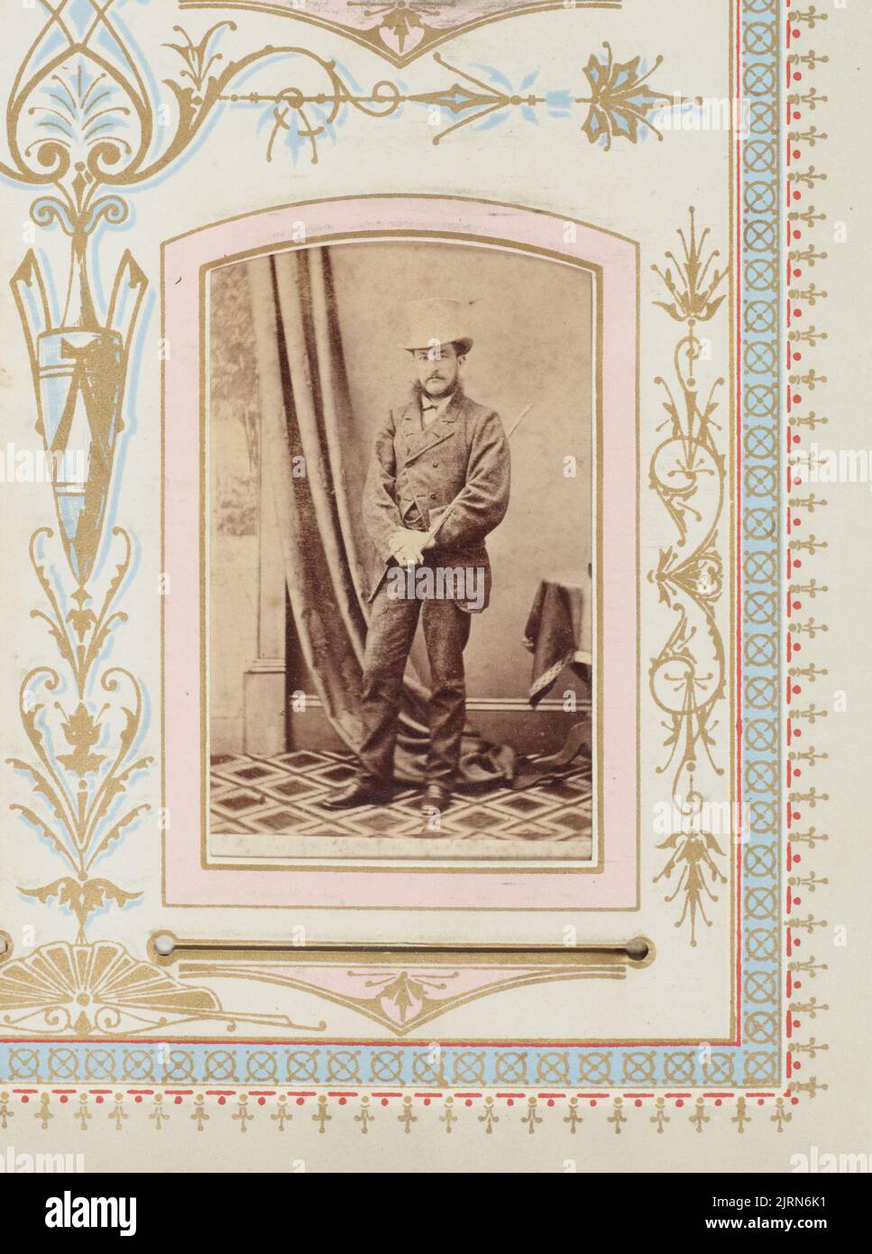 Man wearing top hat and holding cane under his arm. From the album: The ...