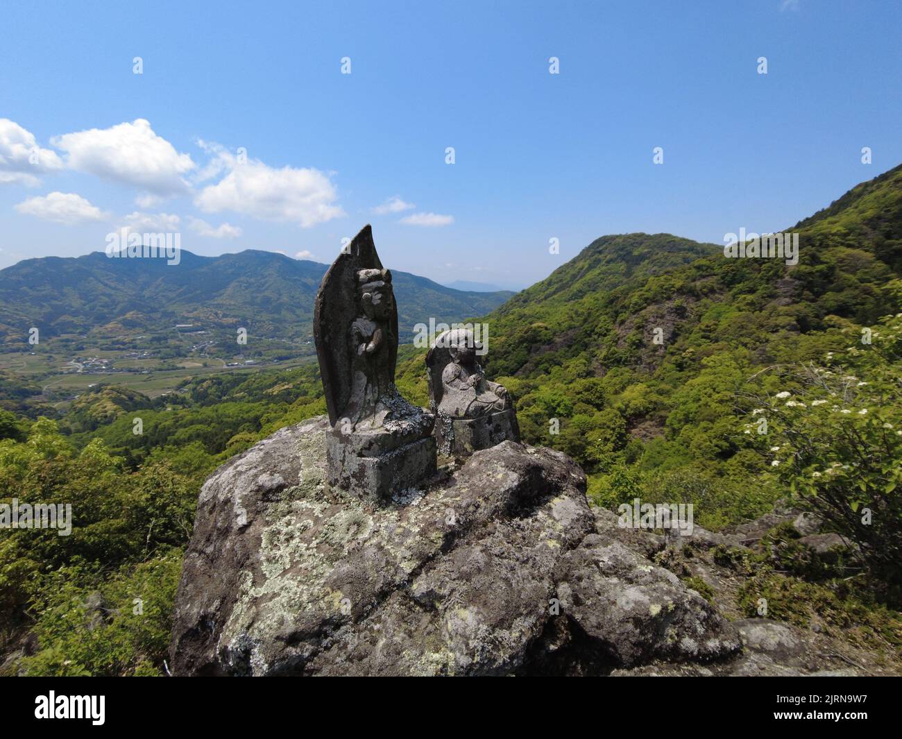 An aerial view of stony statues in background of greenery huge ...