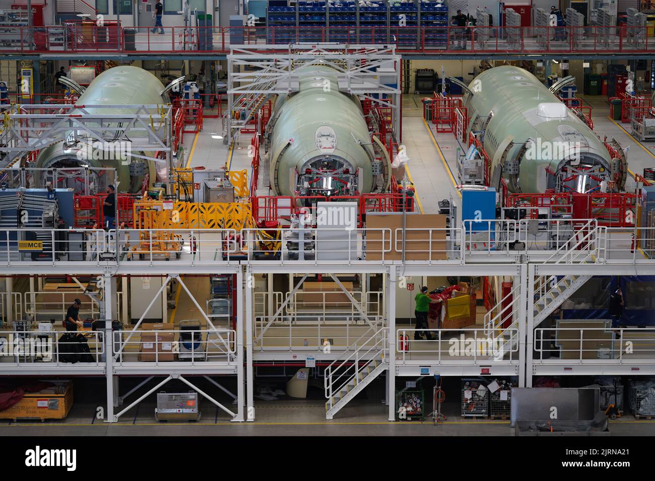 24 August 2022, Hamburg: Airbus employees work on the A320 fuselages in ...