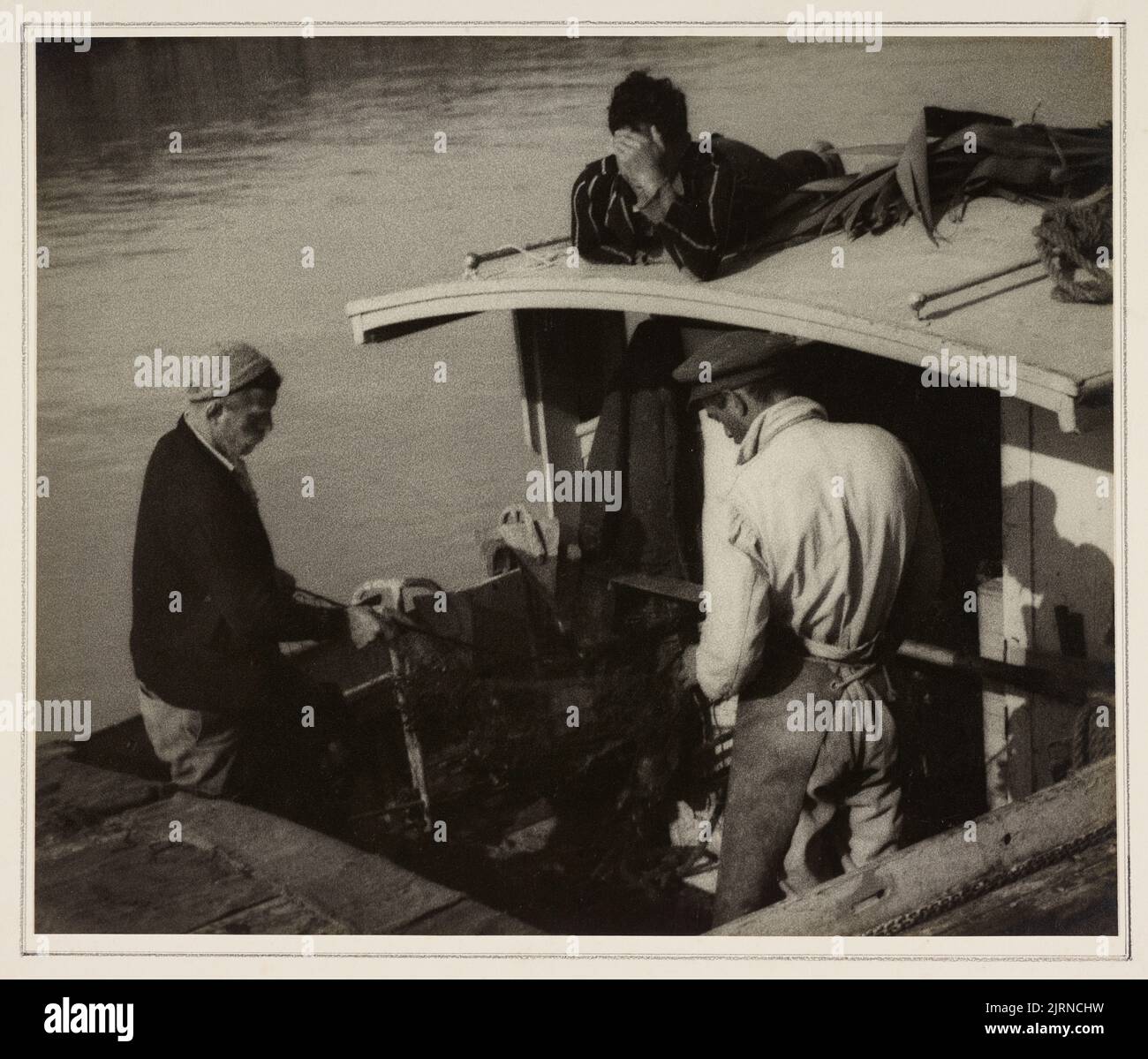Untitled [Men on fishing boat], circa 1940s, by H. Farmer McDonald ...
