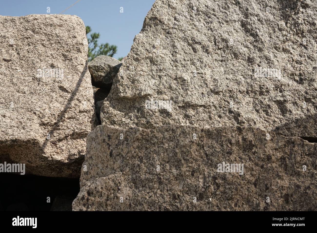 Structure of granite. Large stones on the seashore. Creative vintage ...