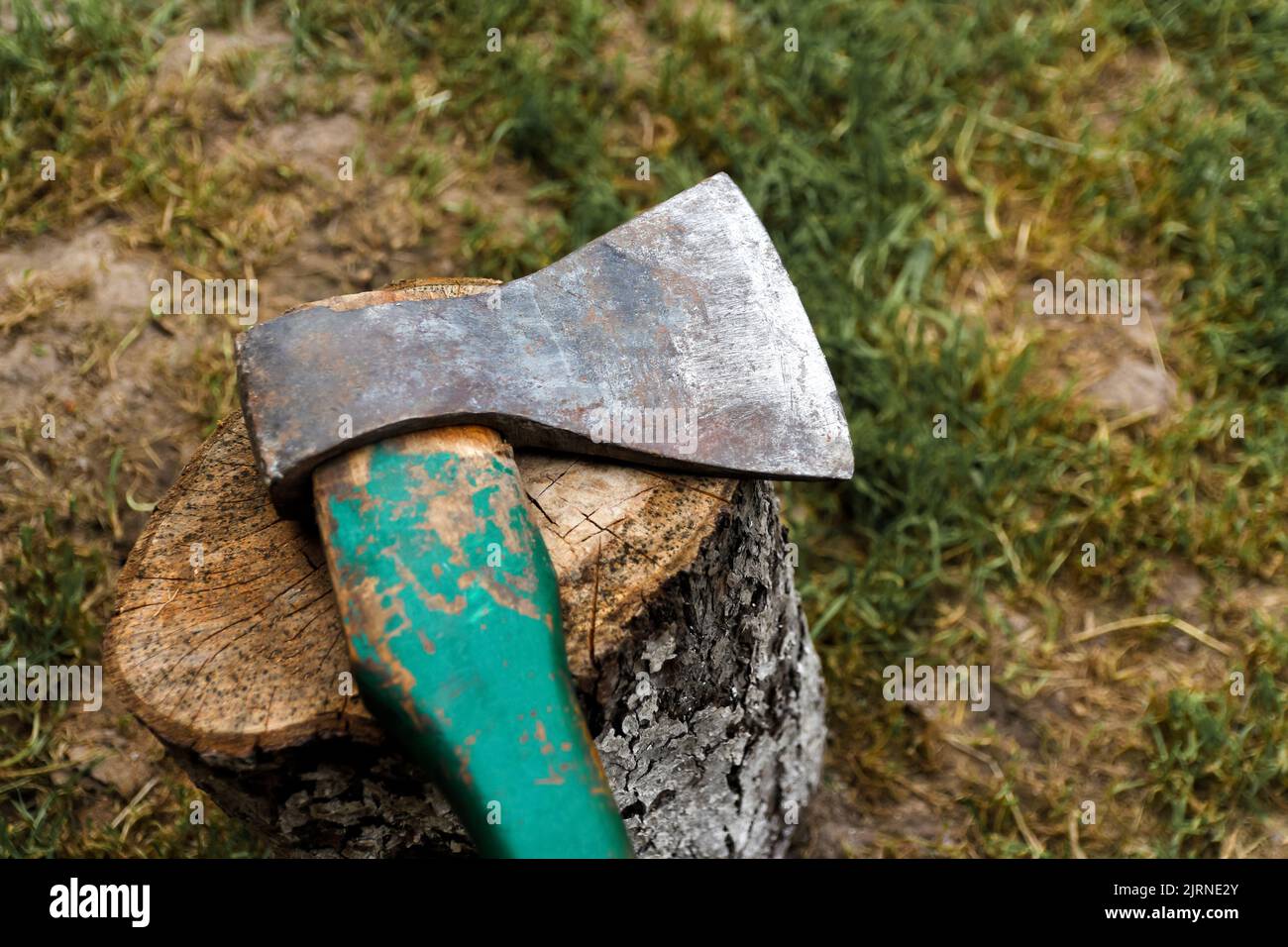 Defocus steel ax closeup. Big steel axe with wooden handle, metal ax ...