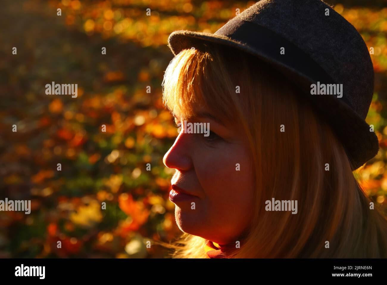 Defocus closeup portrait of smiling young Caucasian blonde woman in ...