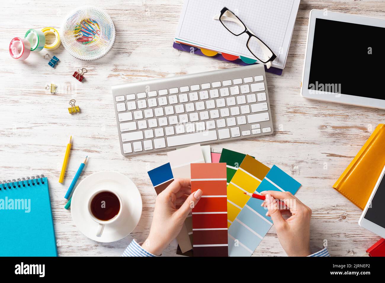 Web designer choosing colors from swatches Stock Photo - Alamy