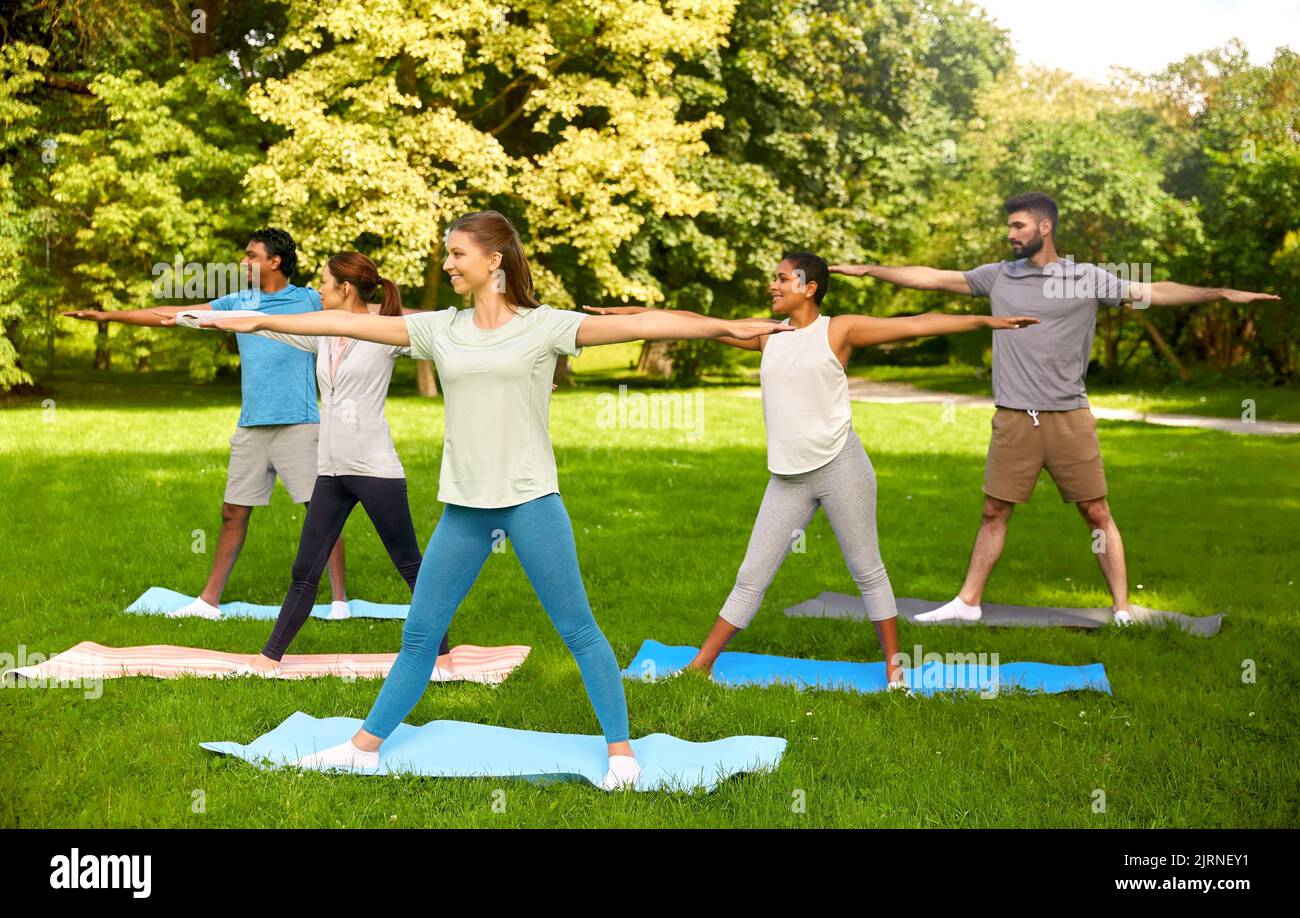 Group people doing yoga warrior hi-res stock photography and images - Alamy