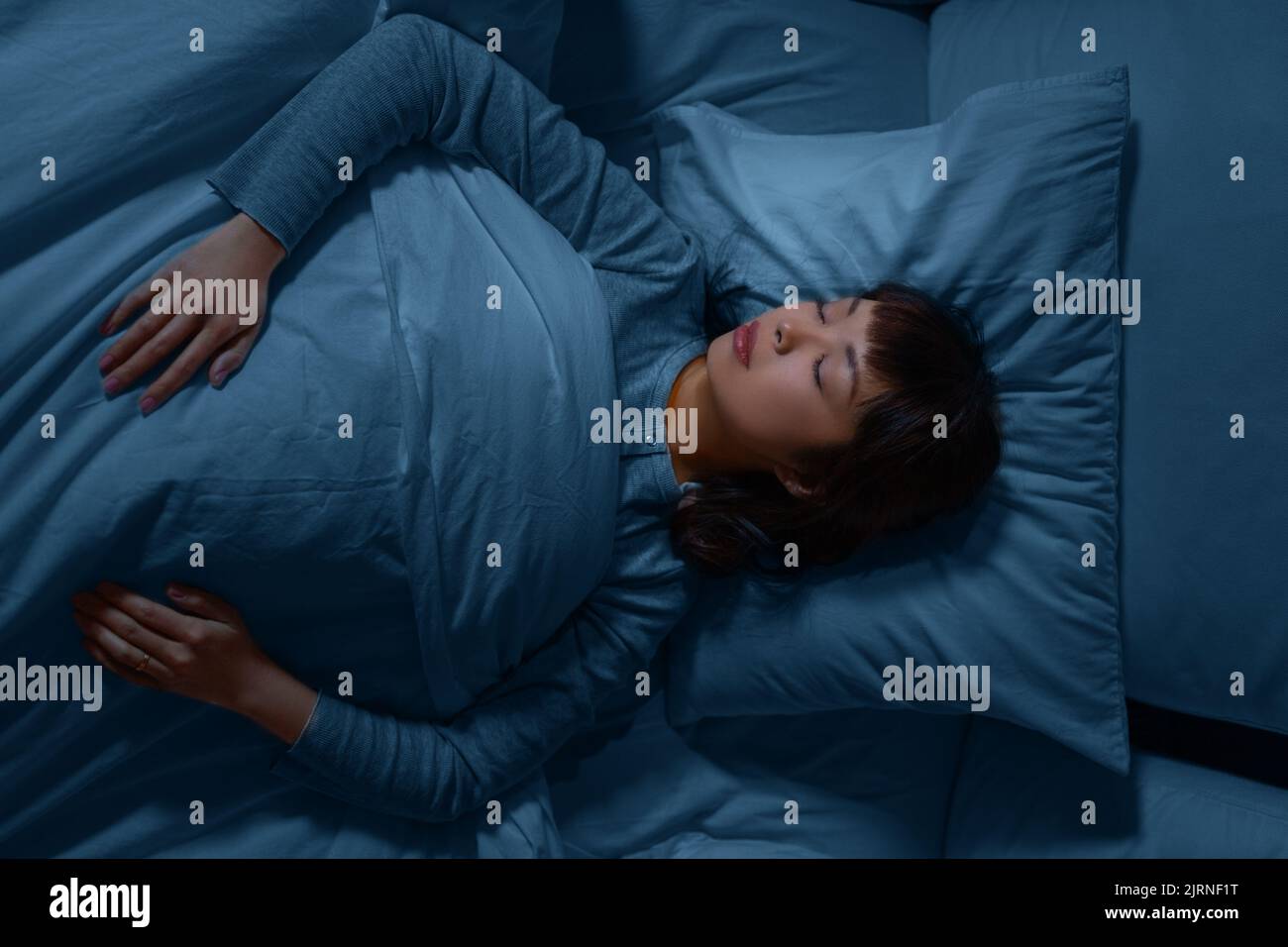 asian woman sleeping in bed at home at night Stock Photo - Alamy