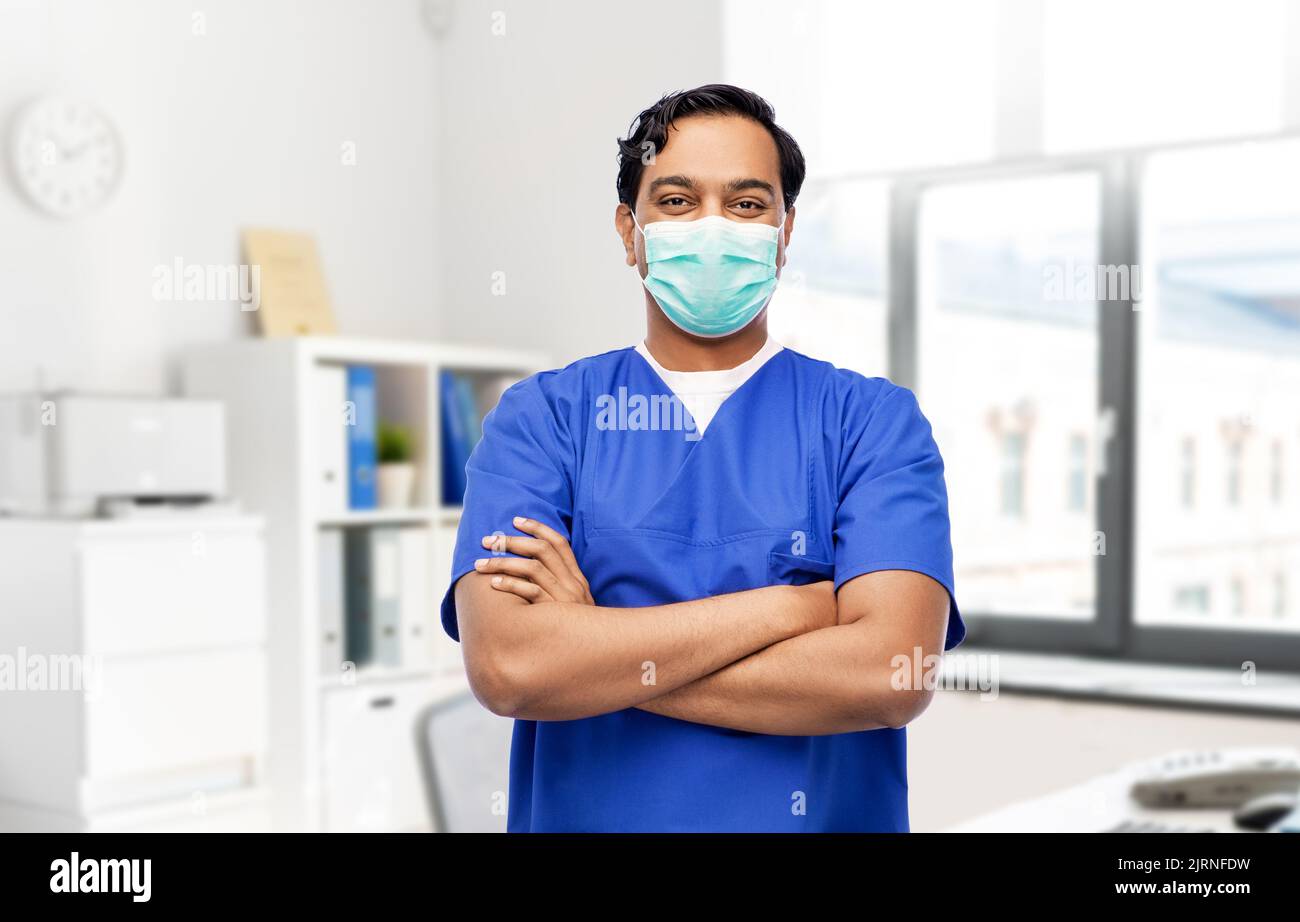 indian male doctor in blue uniform and mask Stock Photo - Alamy