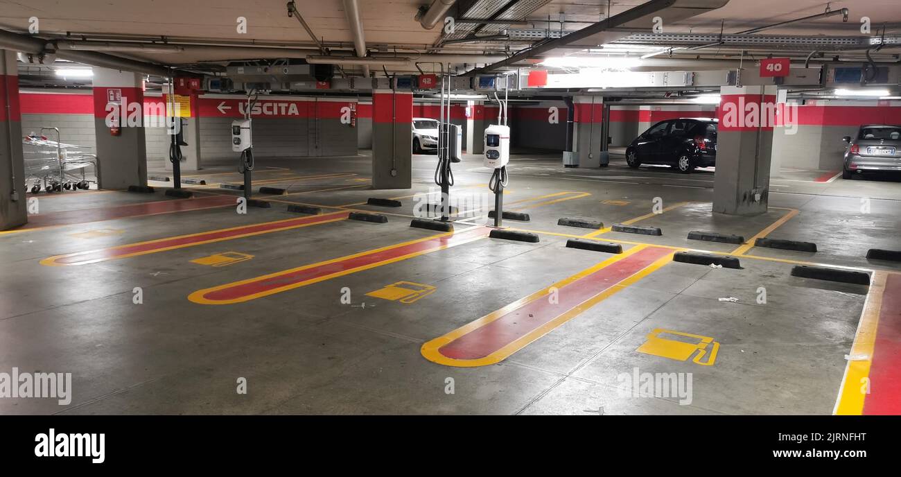 EV parking and charging space in a Milan supermarket Stock Photo - Alamy