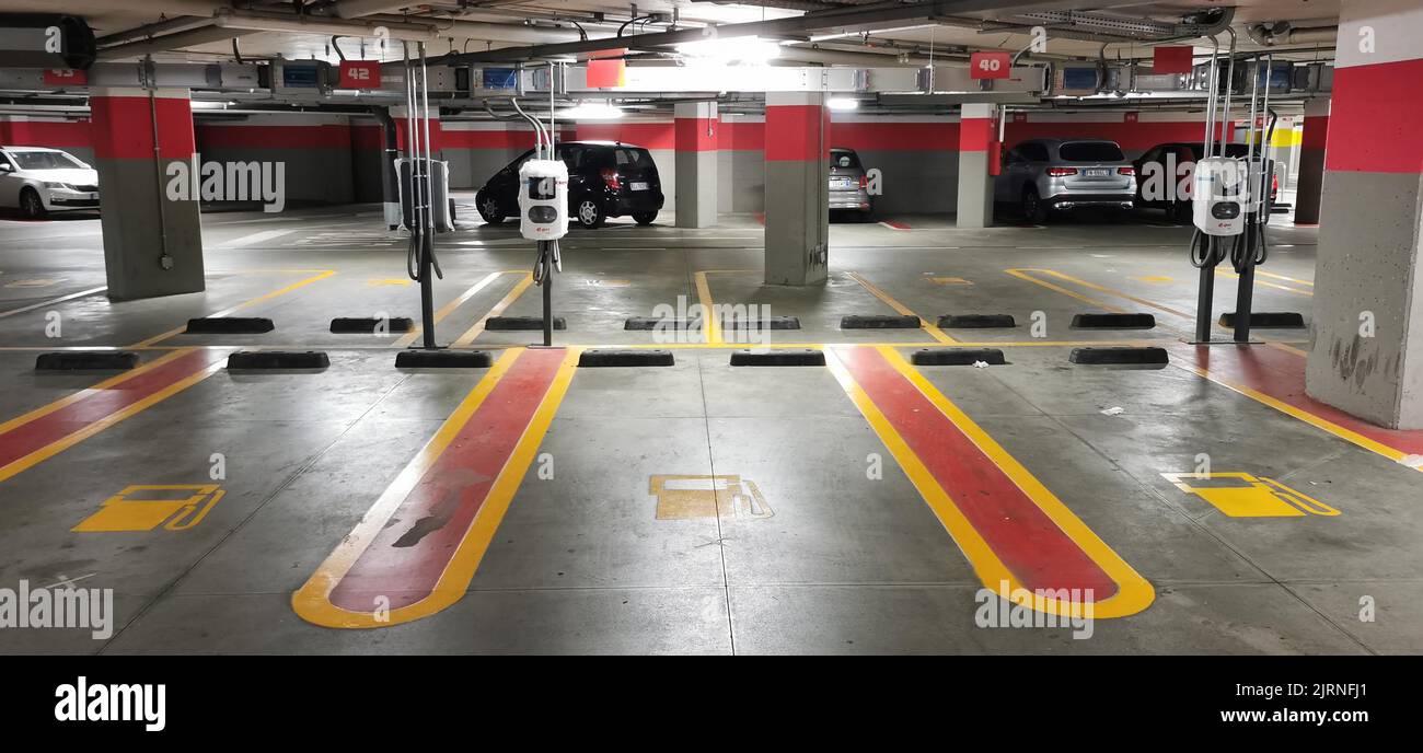 EV parking and charging space in a Milan supermarket Stock Photo - Alamy