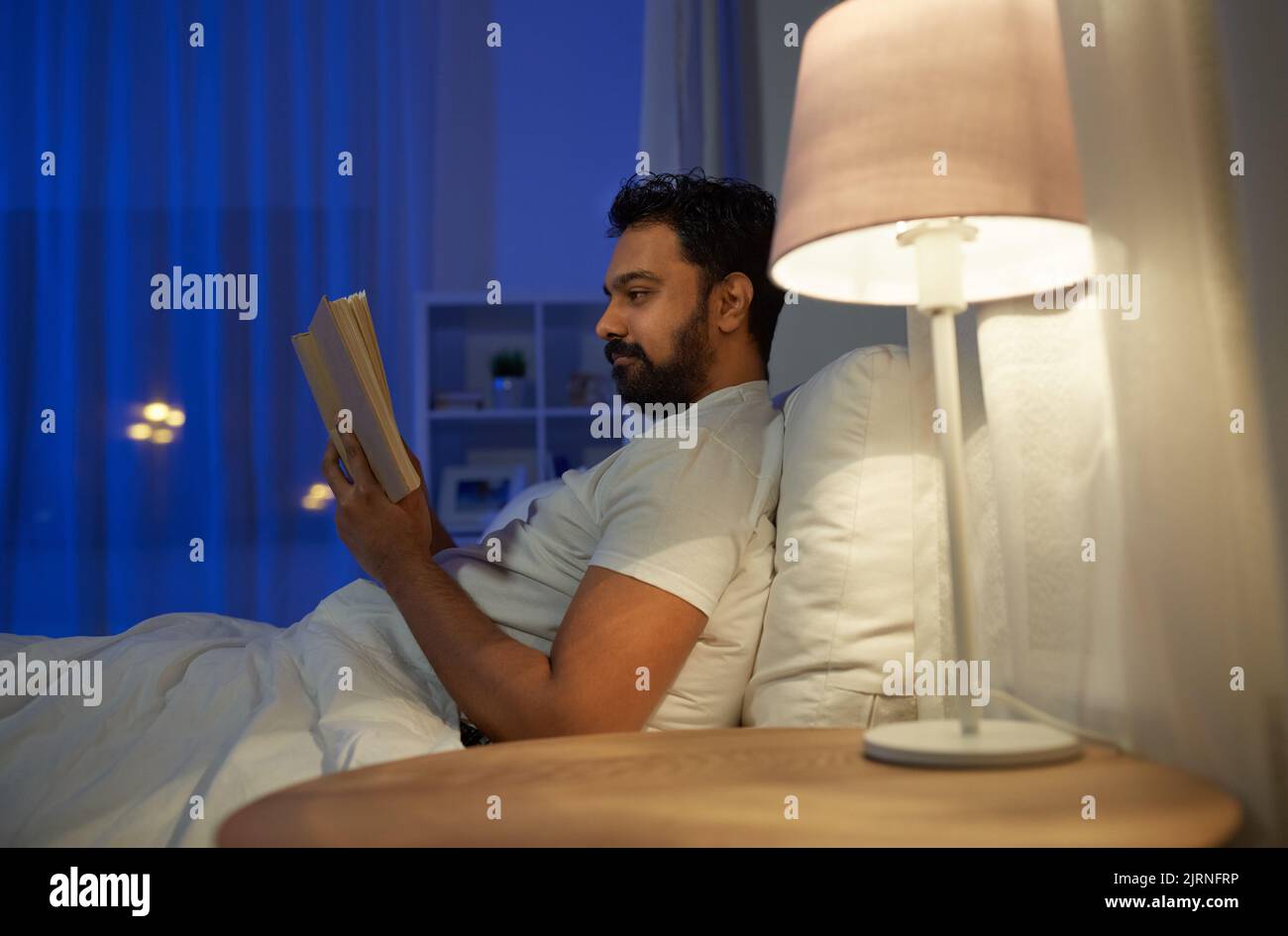 Indian man reading hi-res stock photography and images - Alamy