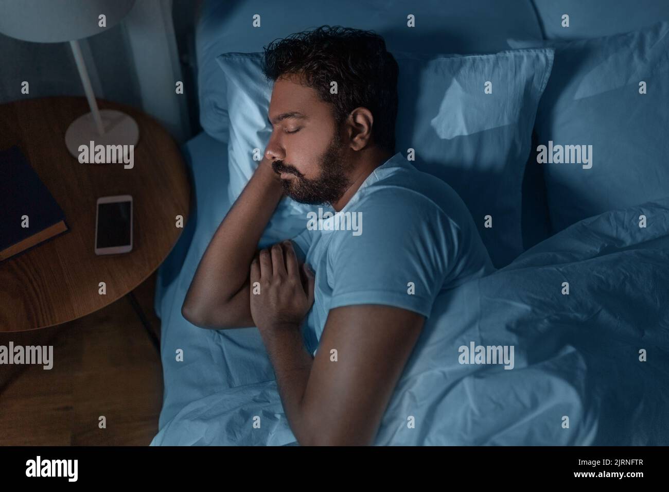 indian man sleeping in bed at home at night Stock Photo - Alamy