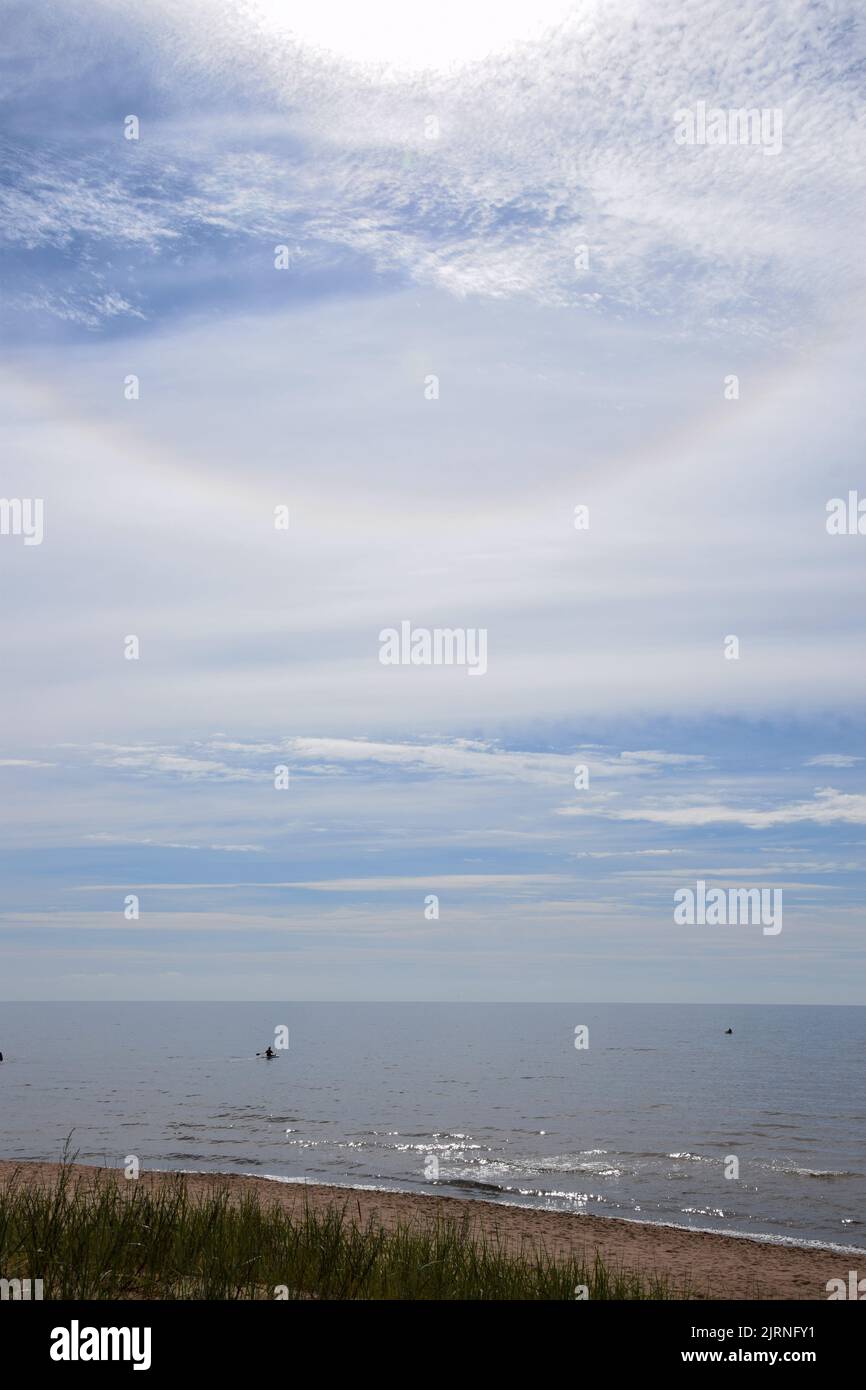 A vertical shot of a sandy beach against a cloudy sky Stock Photo - Alamy