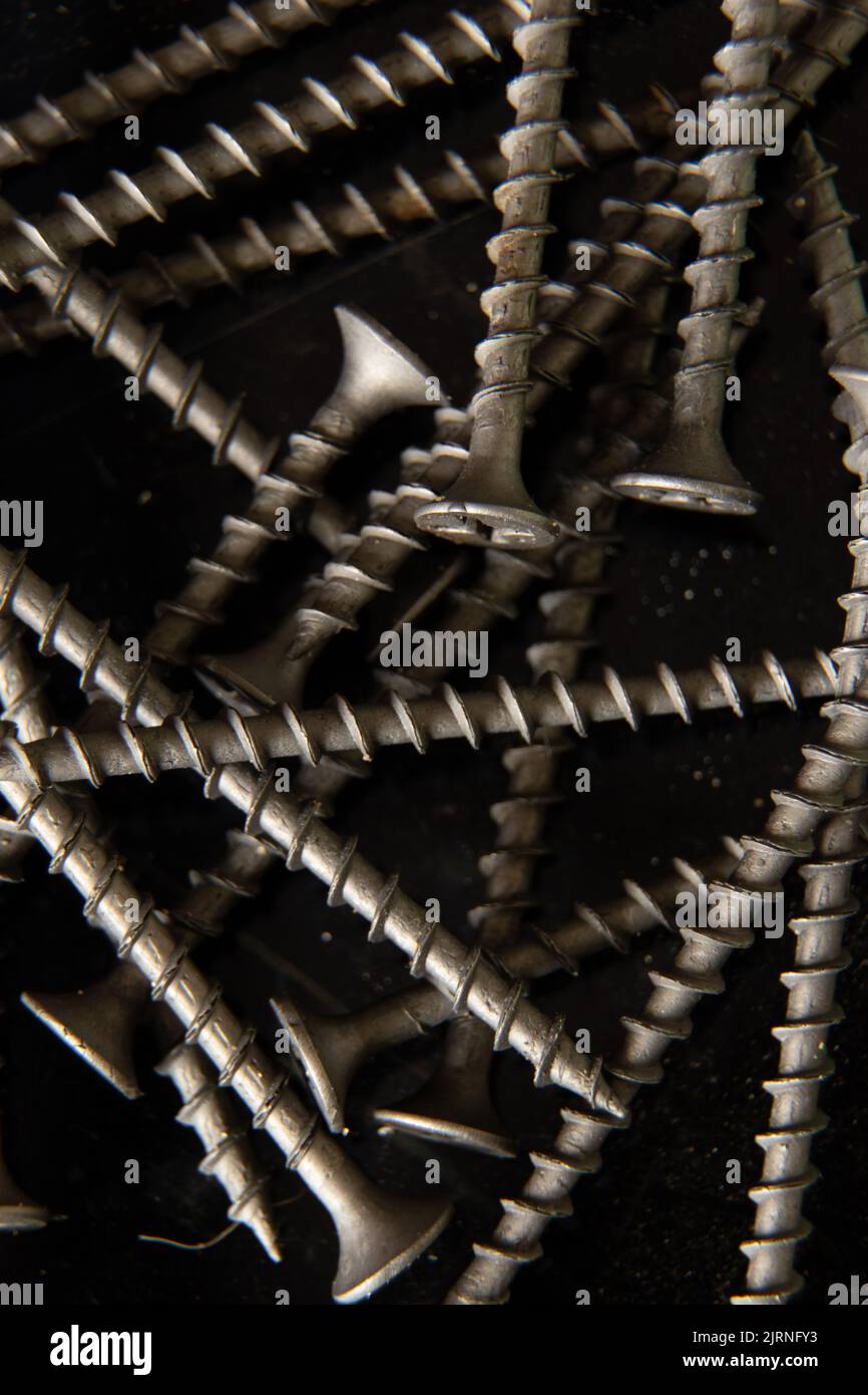old screws and nuts and screws as background, screws and nails for ...