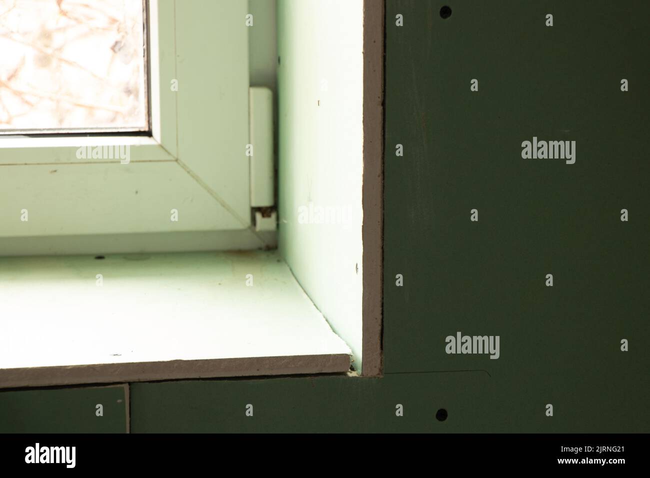 windows with plasterboard slopes, moisture and fungus, apartment ...