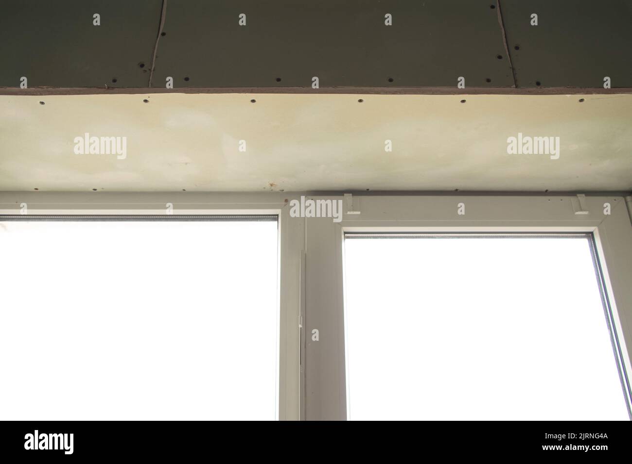 windows with plasterboard slopes, moisture and fungus, apartment ...