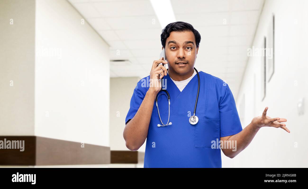 indian doctor or male nurse calling on smartphone Stock Photo - Alamy