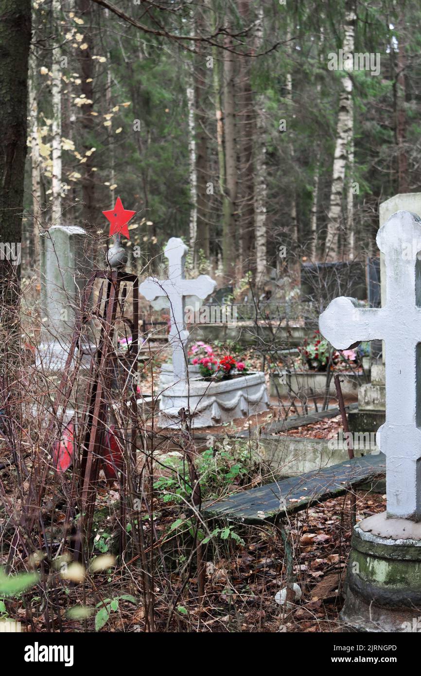 Red star on the metal monument of a unknow soldier in the old cemetery ...