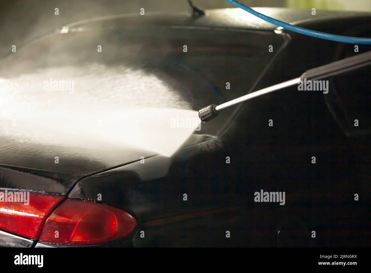 Manual car wash with pressurized water in car wash outside Stock Photo ...