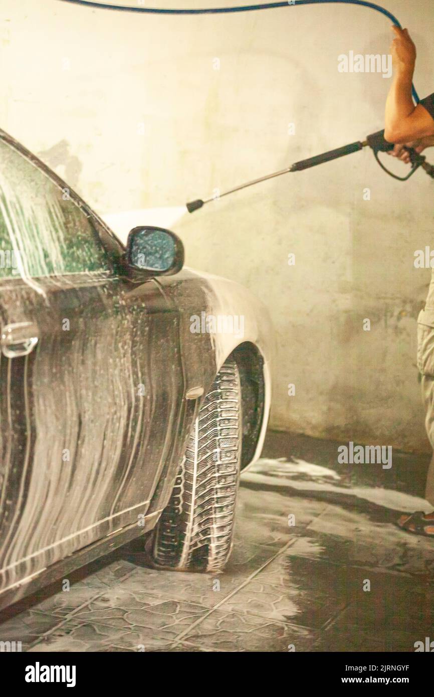 Black car getting wash with soap Stock Photo - Alamy