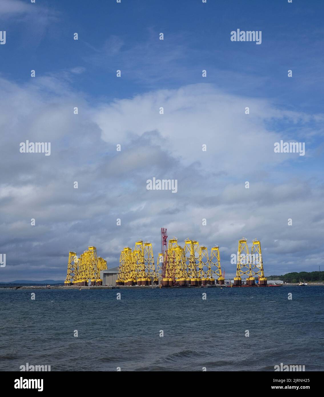 Scotland, Highlands, Cromarty Firth, Wind Farm bases outside factory ...