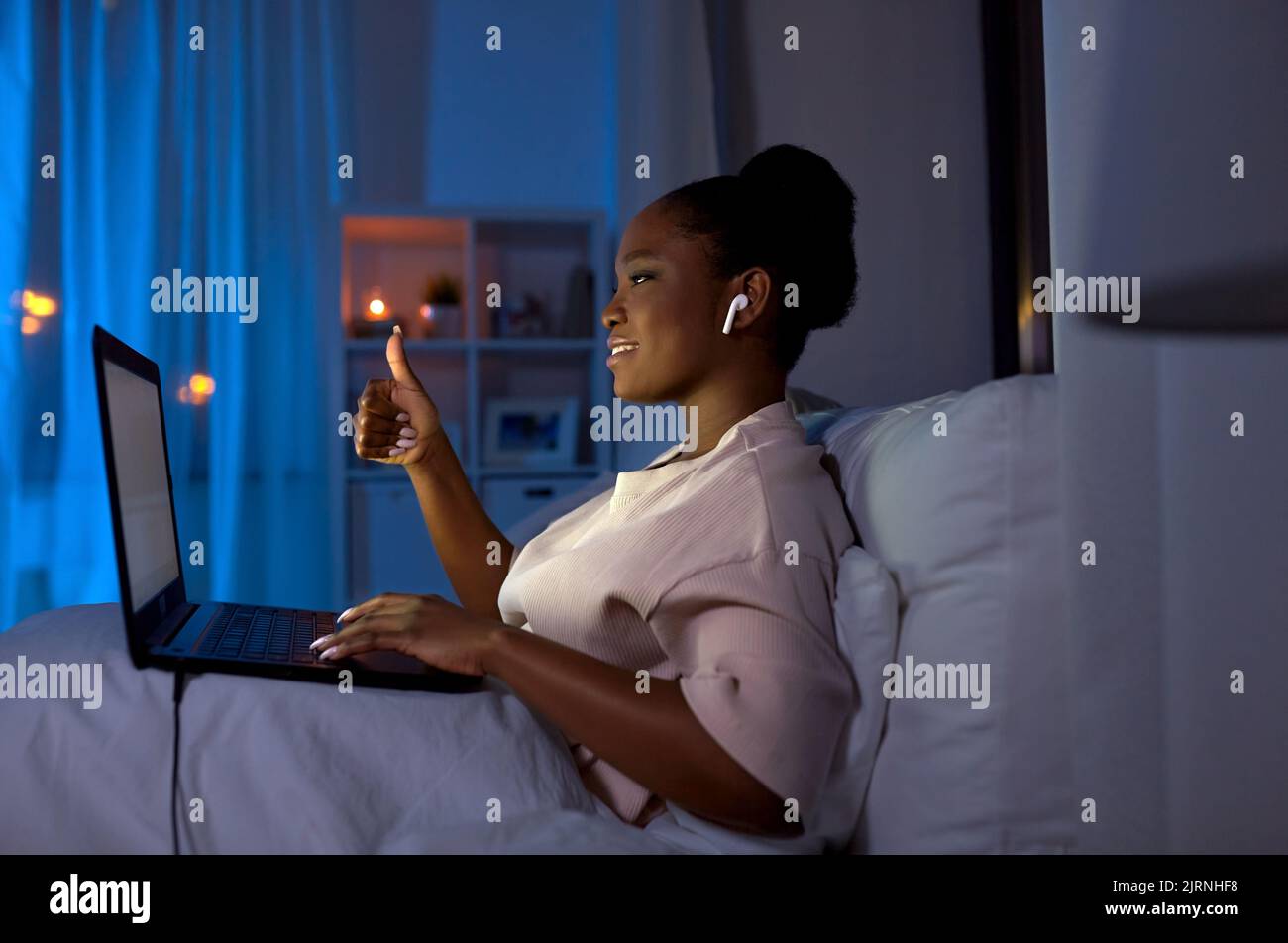 African woman laptop showing thumbs hi-res stock photography and images ...