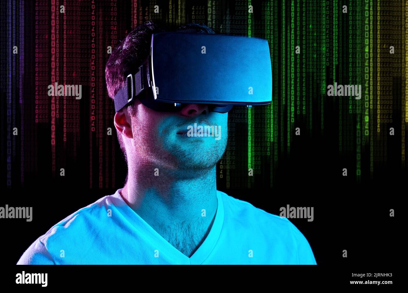 man in vr glasses in neon lights over binary code Stock Photo - Alamy
