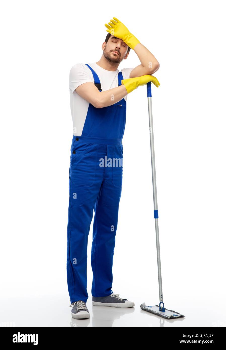 tired male cleaner cleaning floor with mop Stock Photo - Alamy