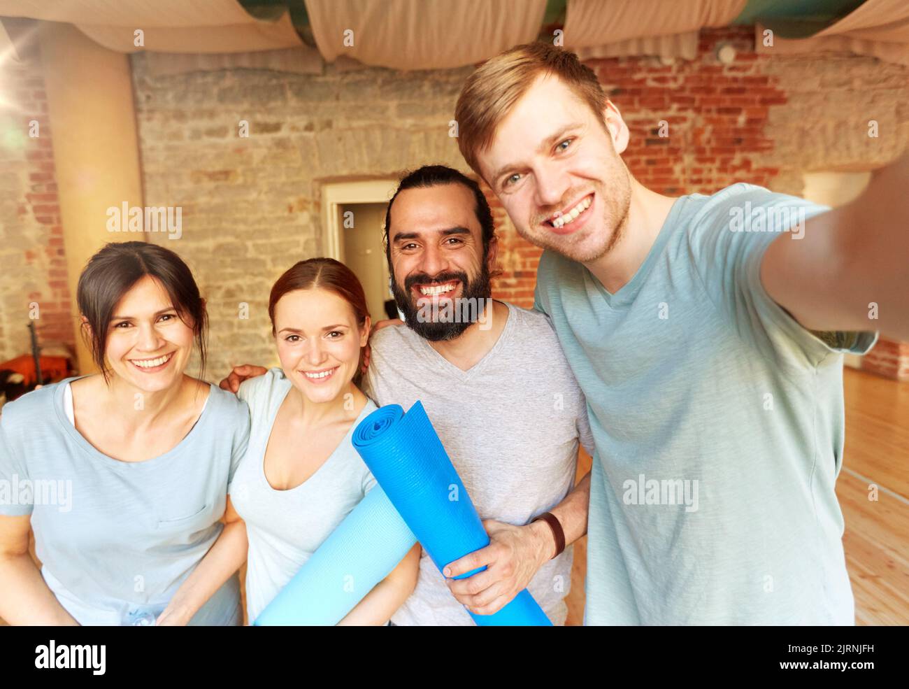 happy friends at yoga studio or gym taking selfie Stock Photo - Alamy