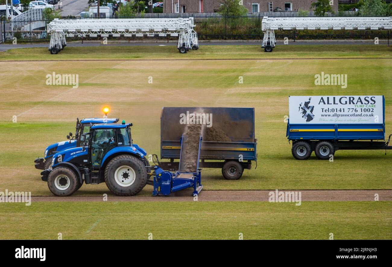 Tractor lifting turf at BT Murrayfield Rugby Ground Stadium, Edinburgh ...