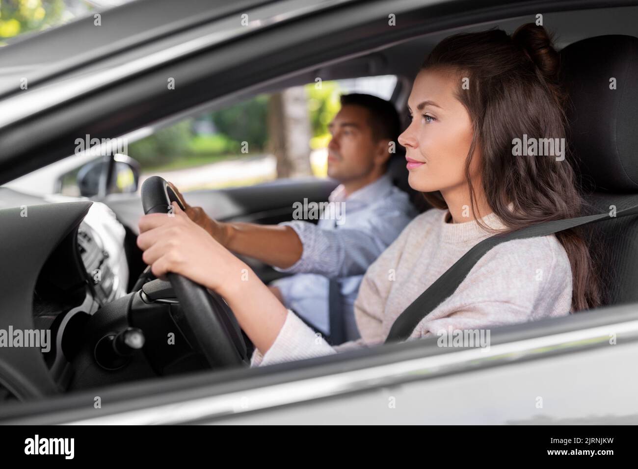 car driving school instructor teaching woman Stock Photo - Alamy