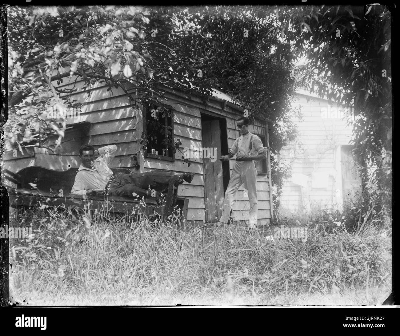 2 men near house, by Crombie and Permin Stock Photo - Alamy
