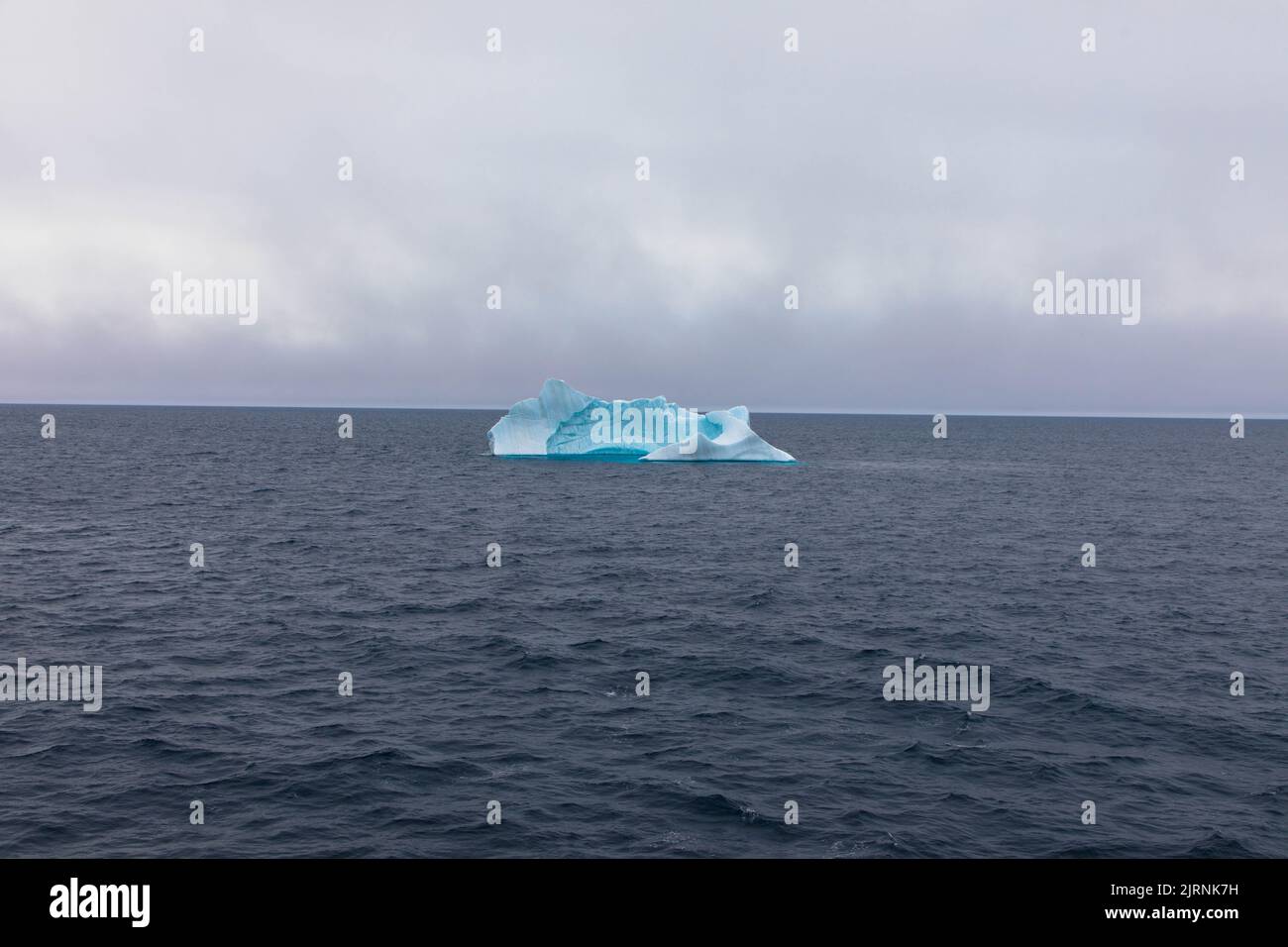 Iceberg from a melting glacier in the arctic. The icy landscape of the ...